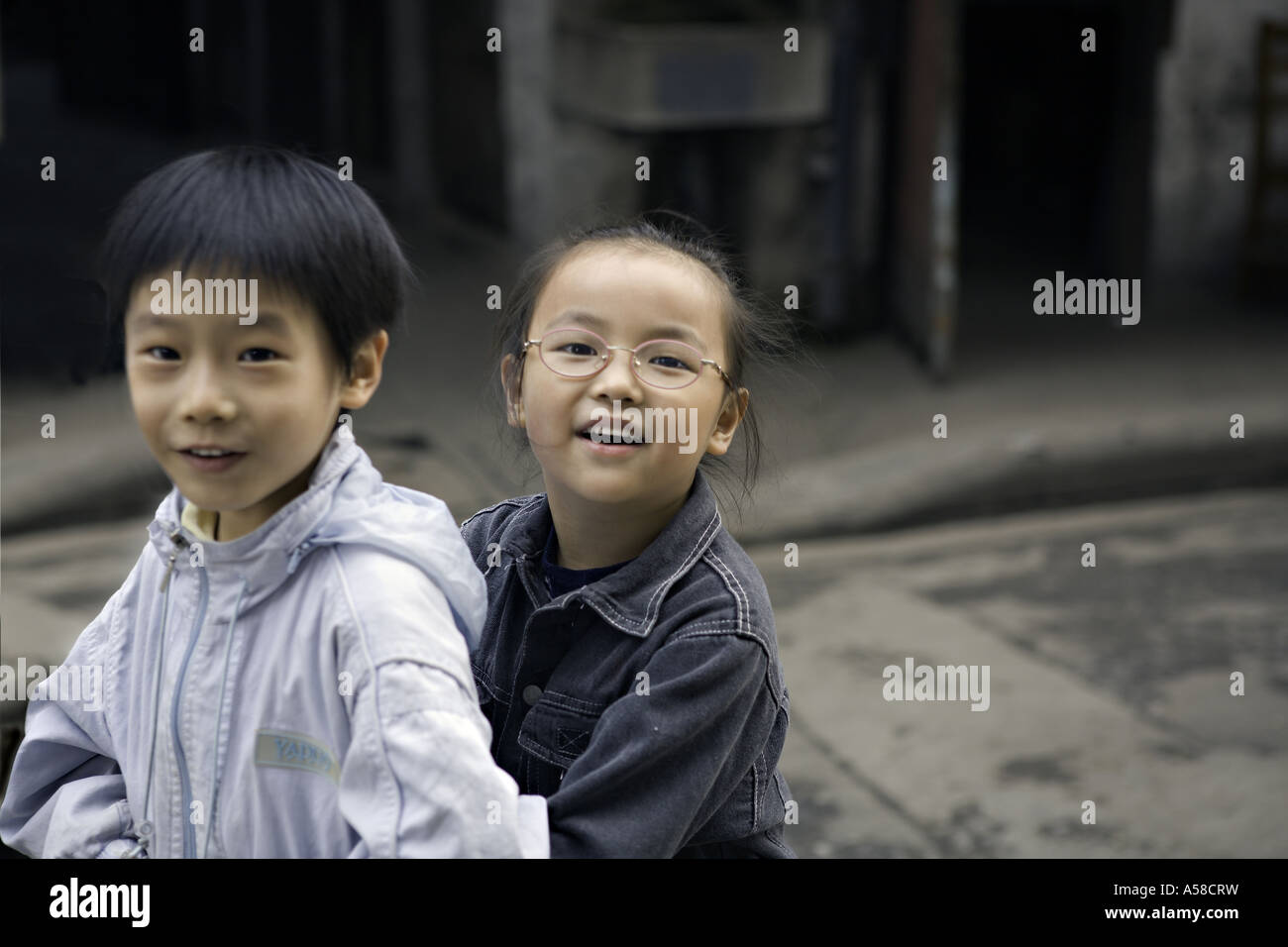 CHINA SHANGHAI Young Chinese friends hug on the way home from school on ...
