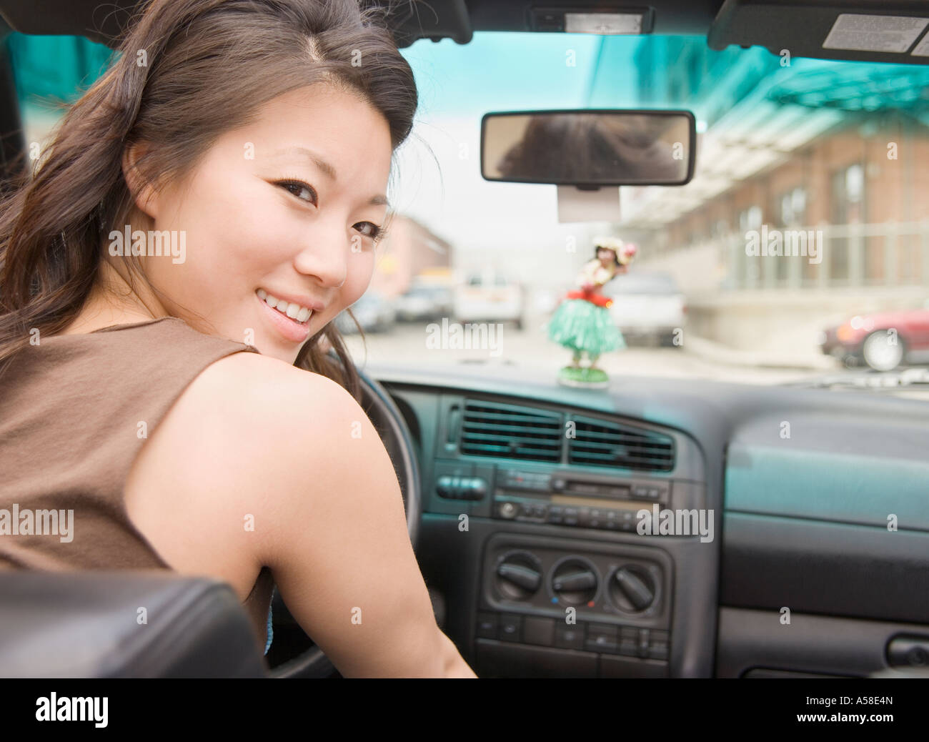 Young Asian woman driving car Stock Photo - Alamy