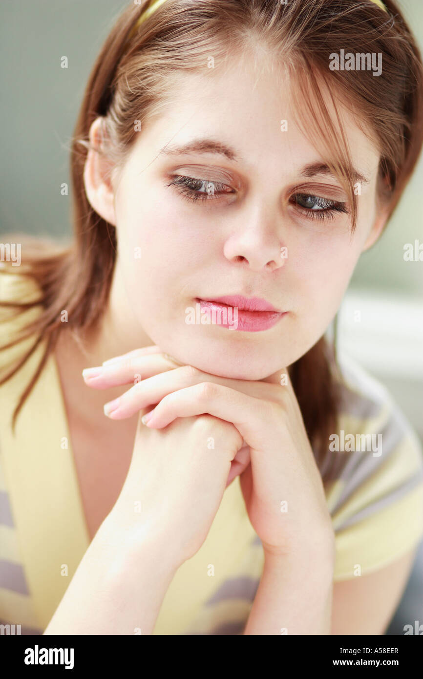 Girl looking thoughtful Stock Photo - Alamy