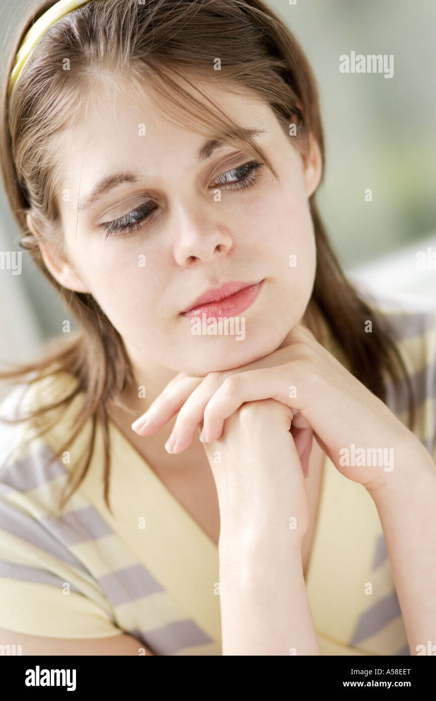 Girl looking thoughtful Stock Photo - Alamy