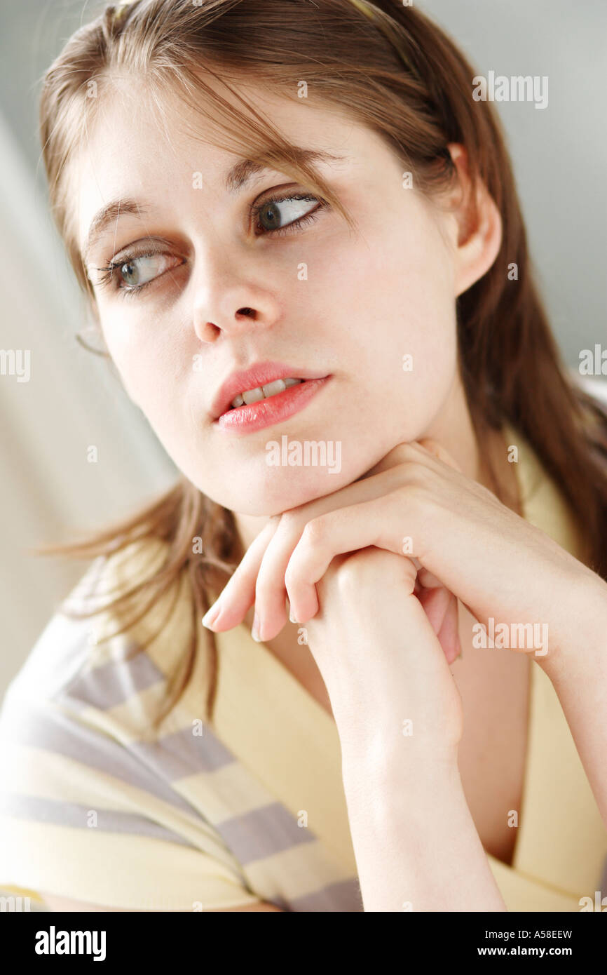 Girl looking thoughtful Stock Photo - Alamy