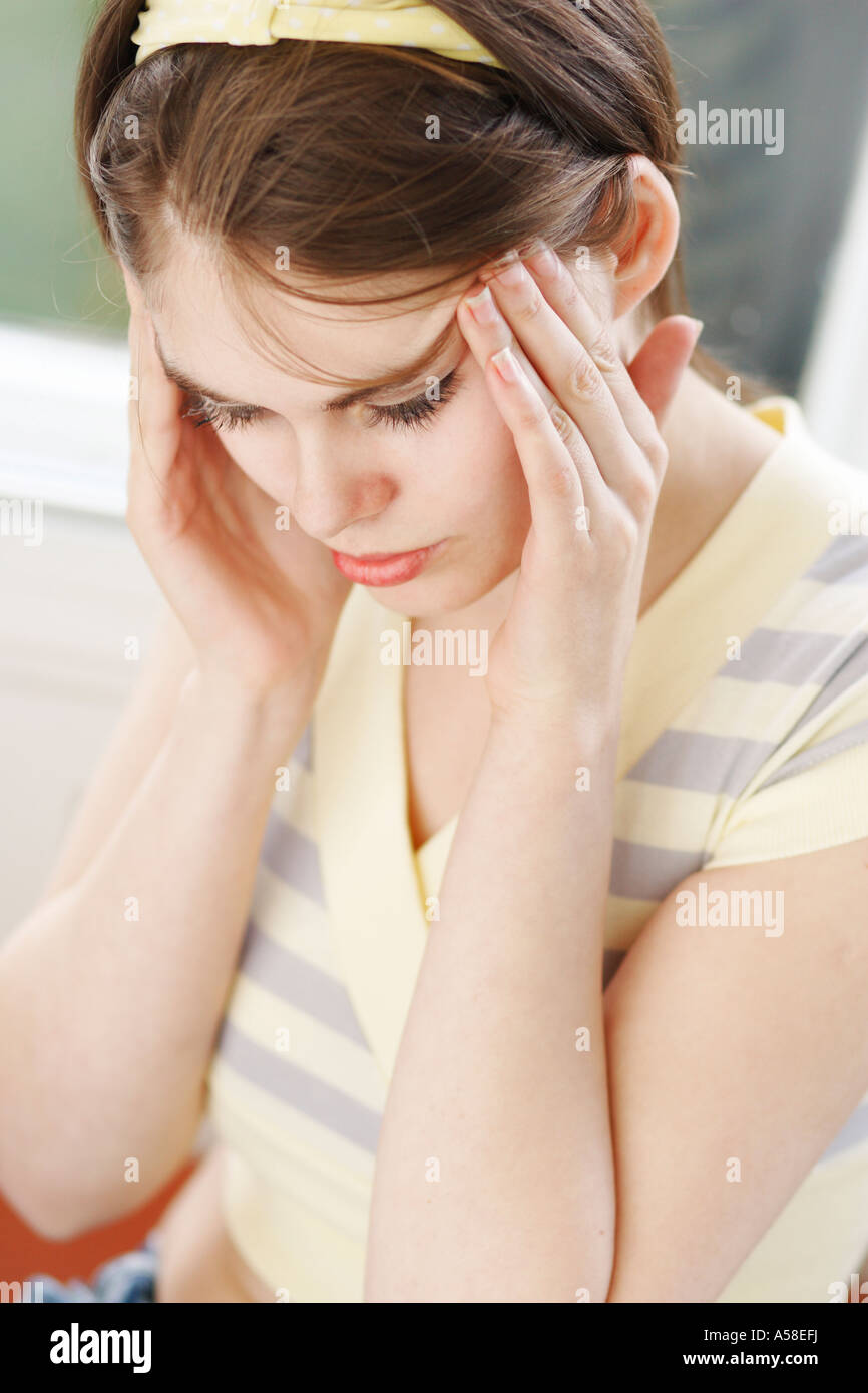 Girl with hands on her head Stock Photo - Alamy