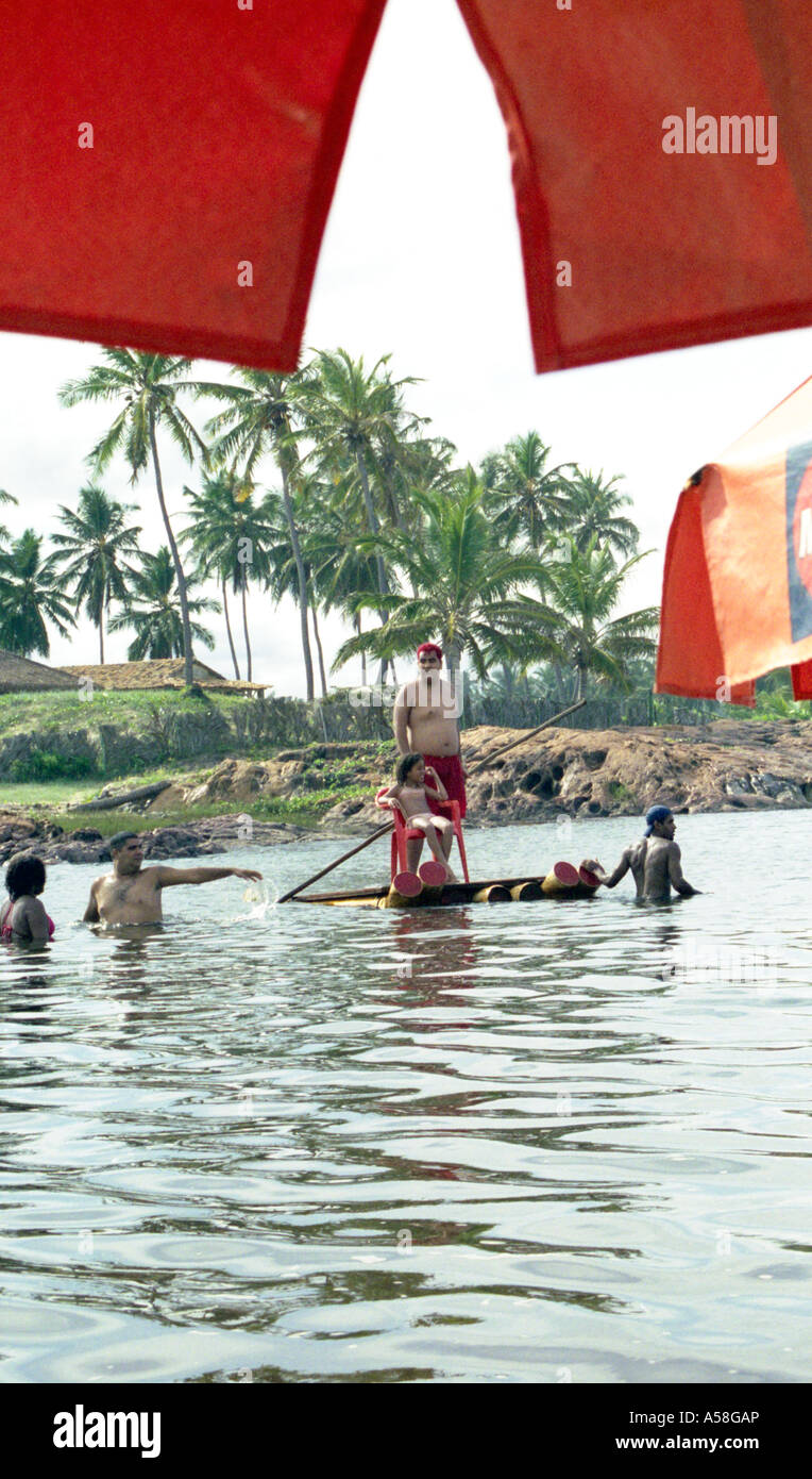 Colour portrait of Brazilian family enjoying a vacation by the coast ...