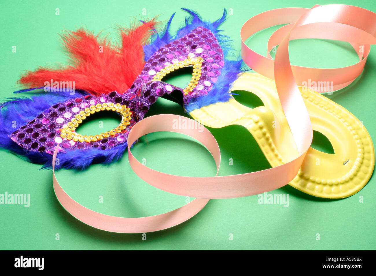 Party Masks and Curling Ribbon Stock Photo - Alamy