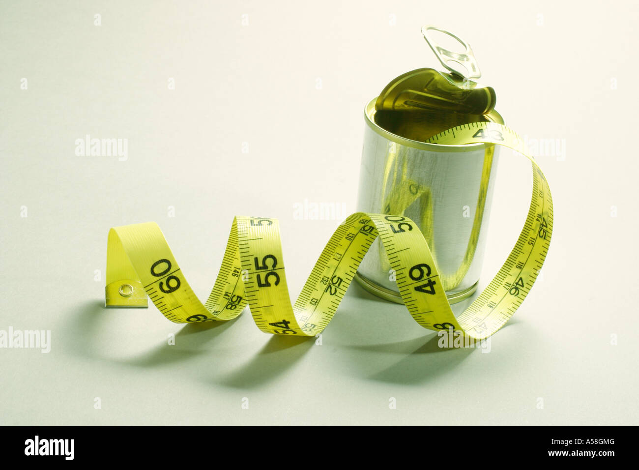 Tin Can with Tape Measure Stock Photo - Alamy