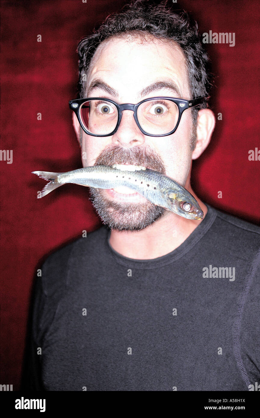 Surprised Fish in Mouth Man Stock Photo - Alamy