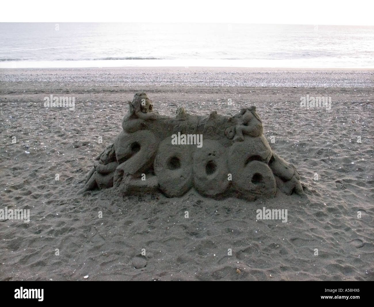 Poor weather at New Year has damaged this sand sculpture on the beach ...