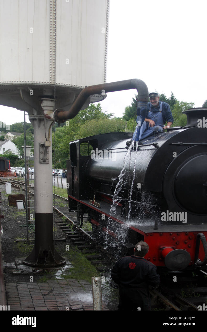 30th August 2006. The train driver gets the water hose and prepares to ...