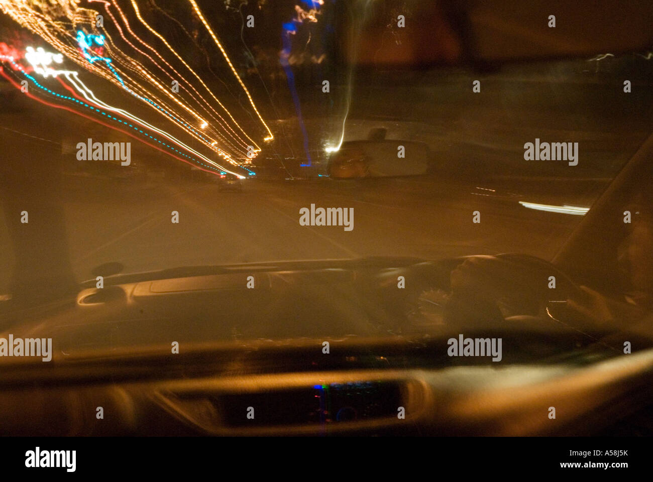 view from a car traveling at night showing the back of a lorry Stock ...