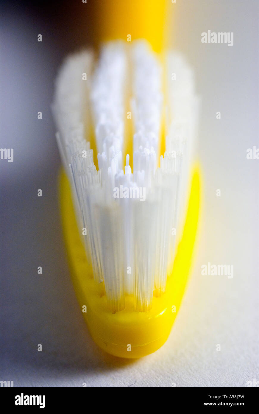 Yellow toothbrush close up Stock Photo - Alamy