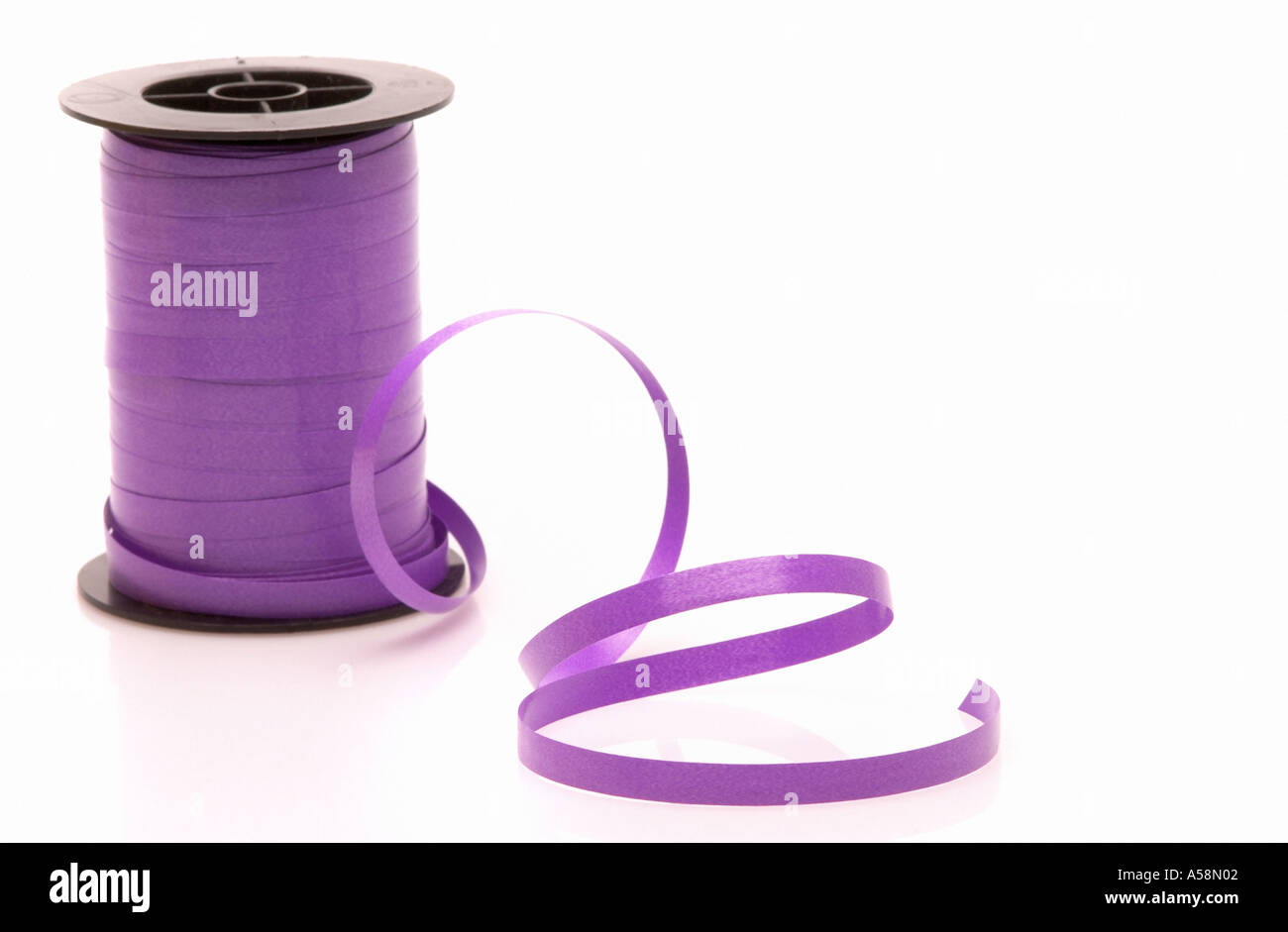 Spool of ribbon for gift wrapping against white background Stock Photo ...