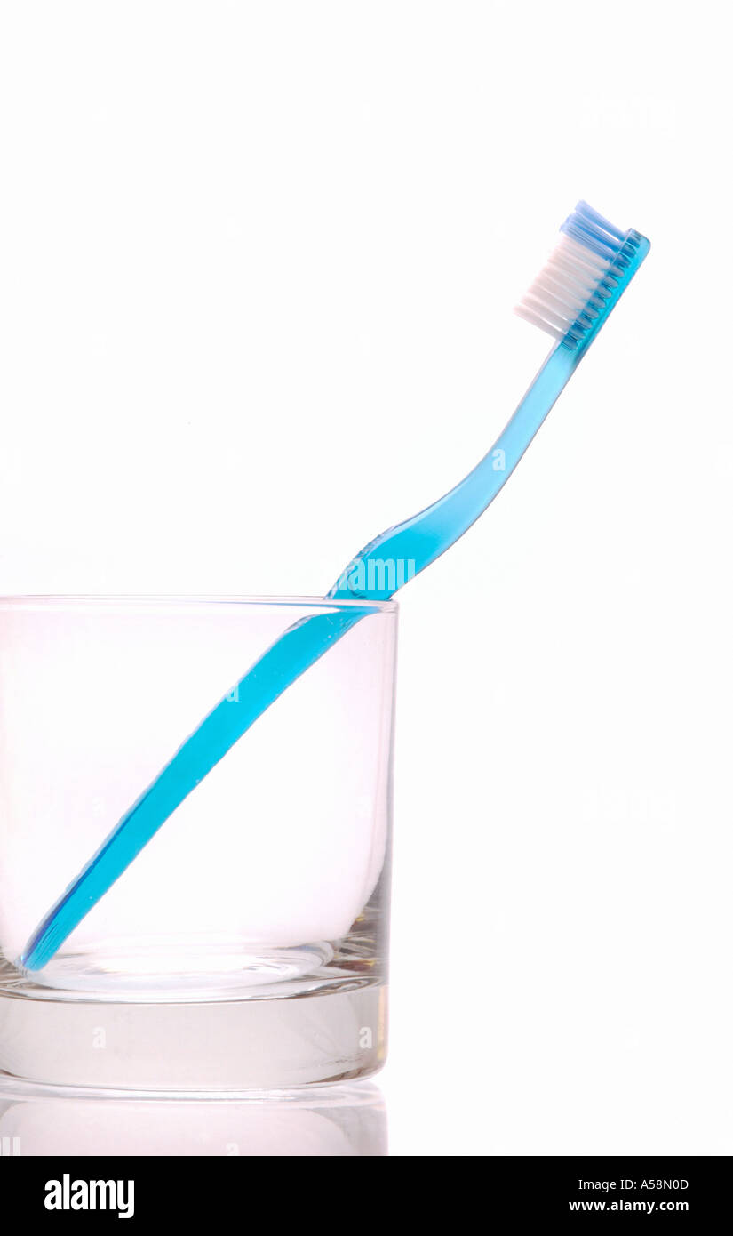 Blue transparent toothbrush in glass on white background Stock Photo ...