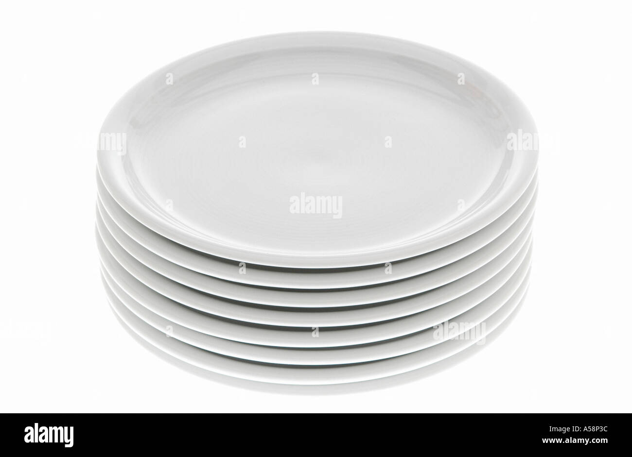 Stack of white plates on white background Stock Photo - Alamy