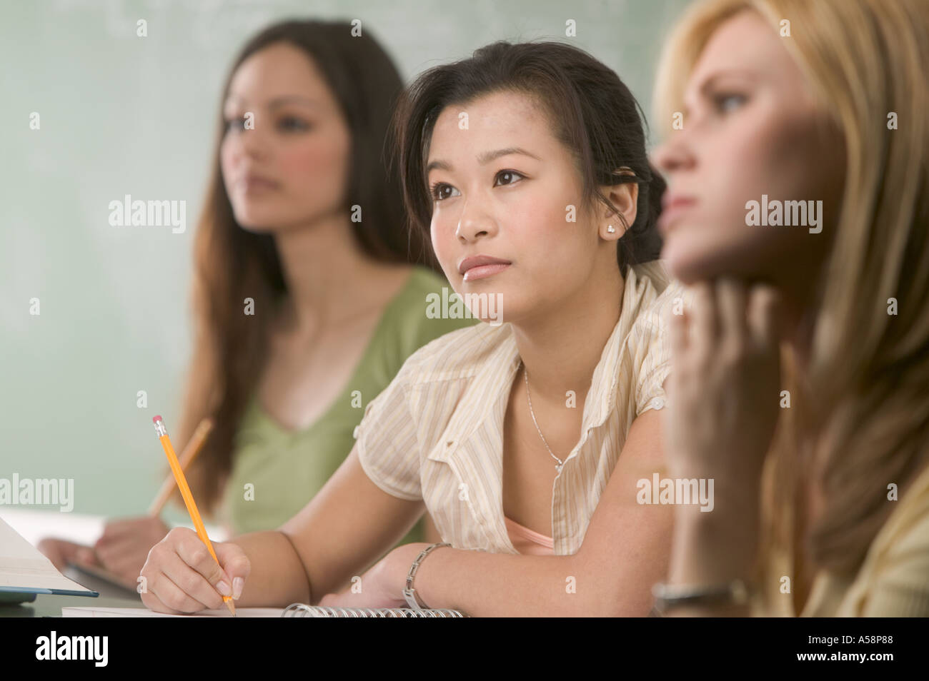 Women taking notes in class Stock Photo - Alamy
