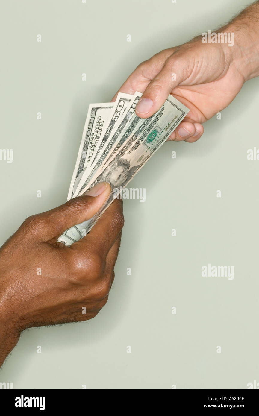 African hands exchanging money hi-res stock photography and images - Alamy