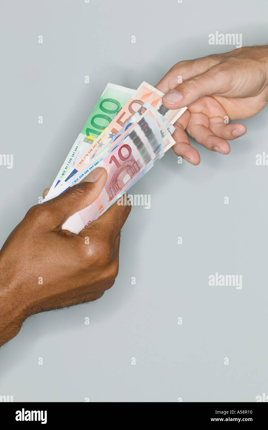 African hands exchanging money hi-res stock photography and images - Alamy