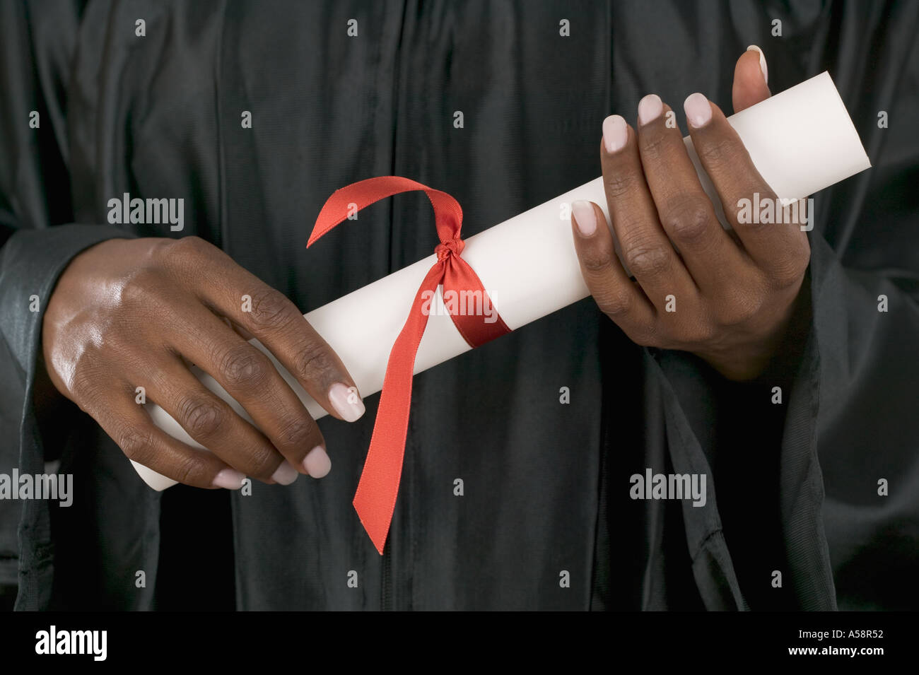 Hands holding diploma Stock Photo - Alamy