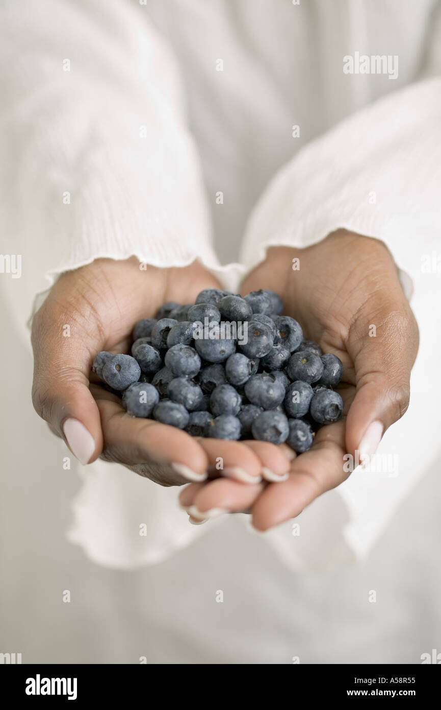 Blueberries in human hand hi-res stock photography and images - Alamy