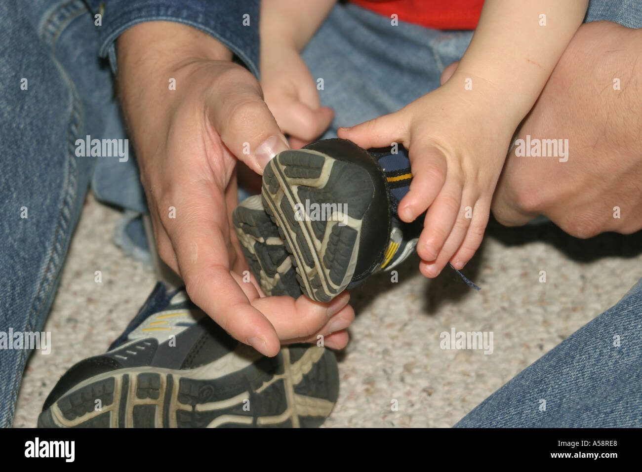 Helping to dress hi-res stock photography and images - Alamy