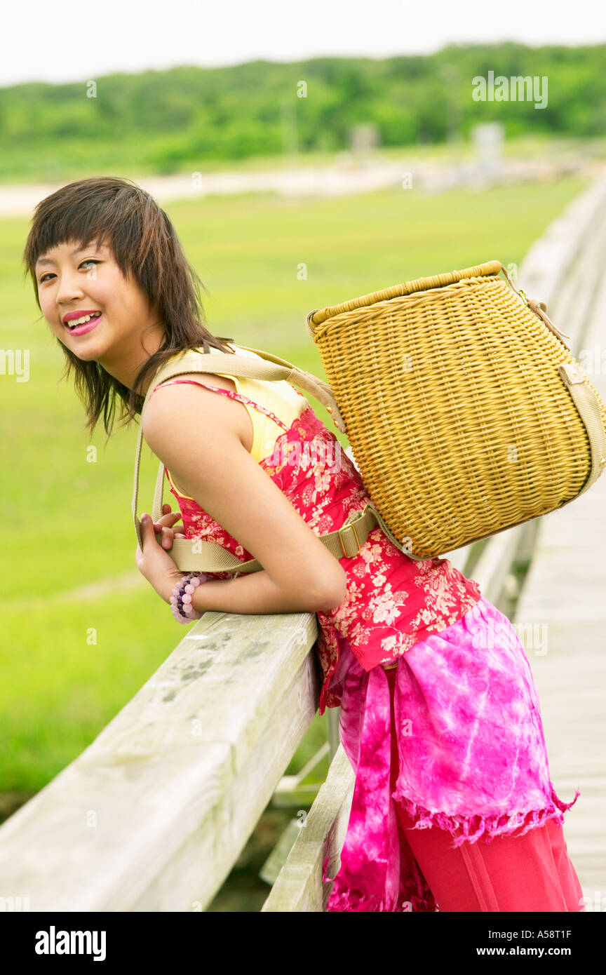 Portrait of woman carrying basket Stock Photo - Alamy
