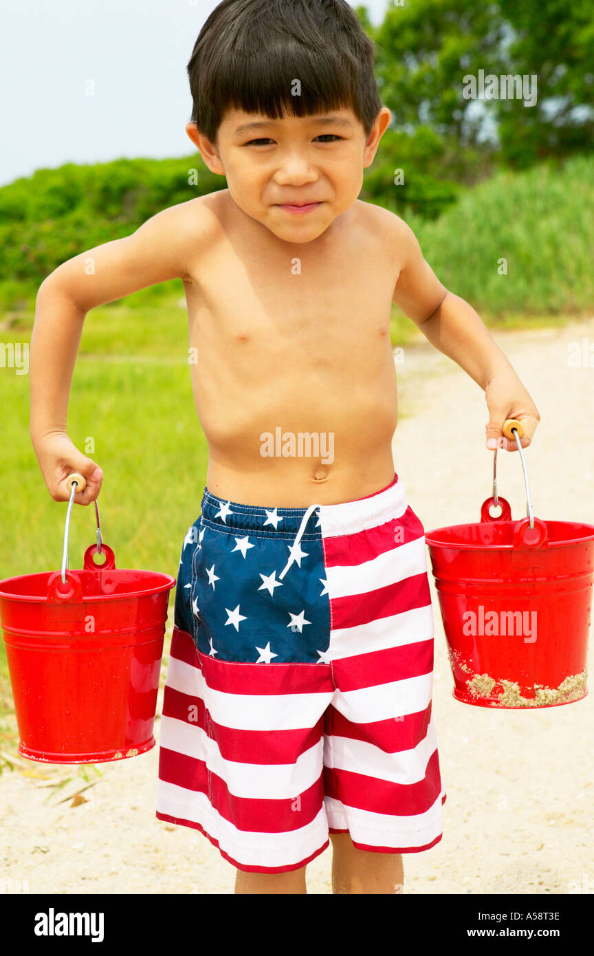 Boy carrying buckets hi-res stock photography and images - Alamy