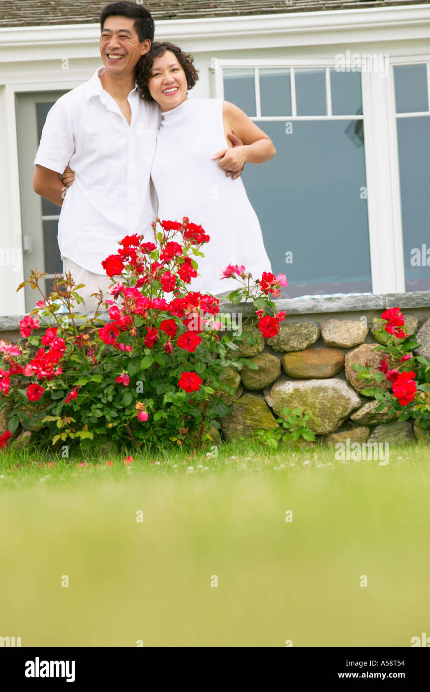 Portrait of couple hugging Stock Photo - Alamy