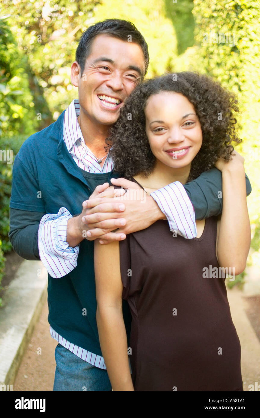 Portrait of couple hugging Stock Photo - Alamy
