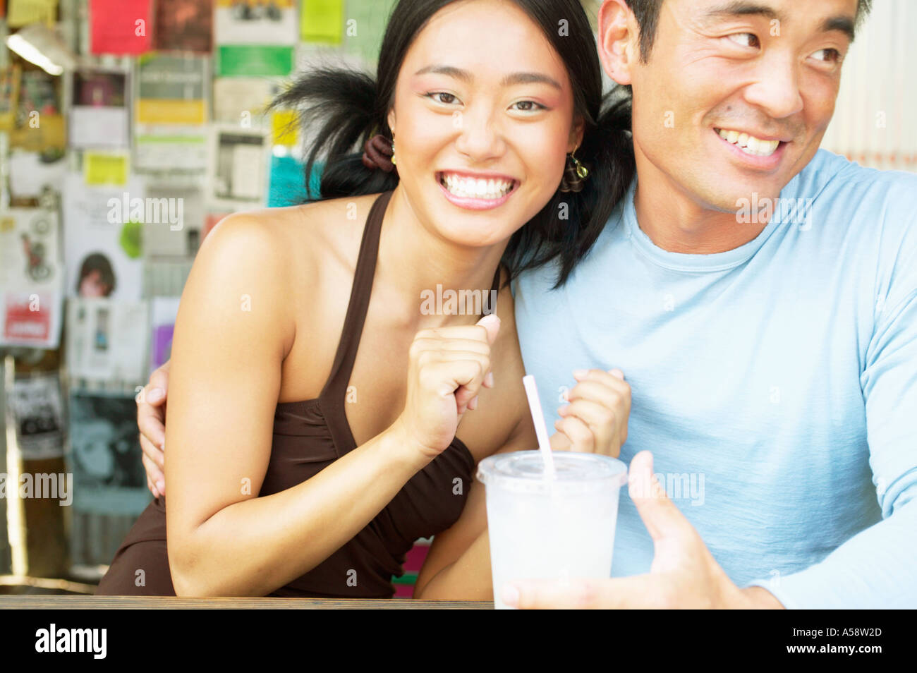 Portrait of couple hugging Stock Photo - Alamy