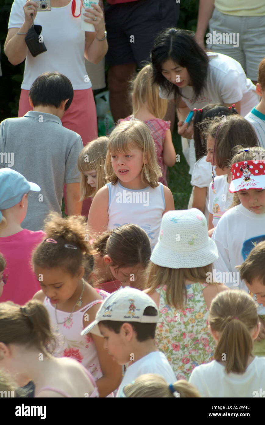 girl standing in a crowd Stock Photo - Alamy
