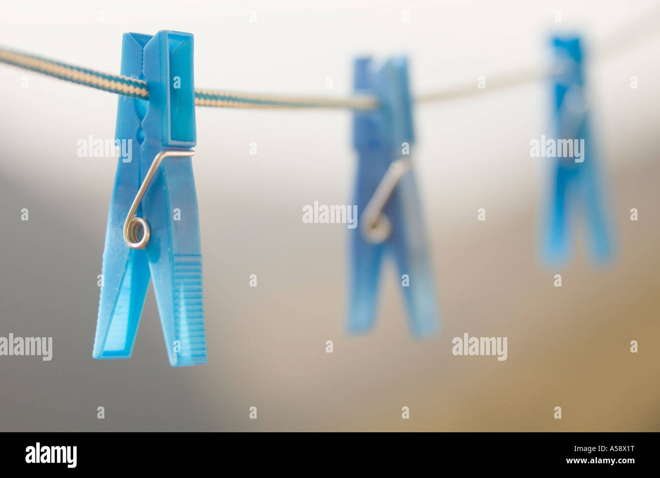 Clothes pegs on a washing line Stock Photo - Alamy