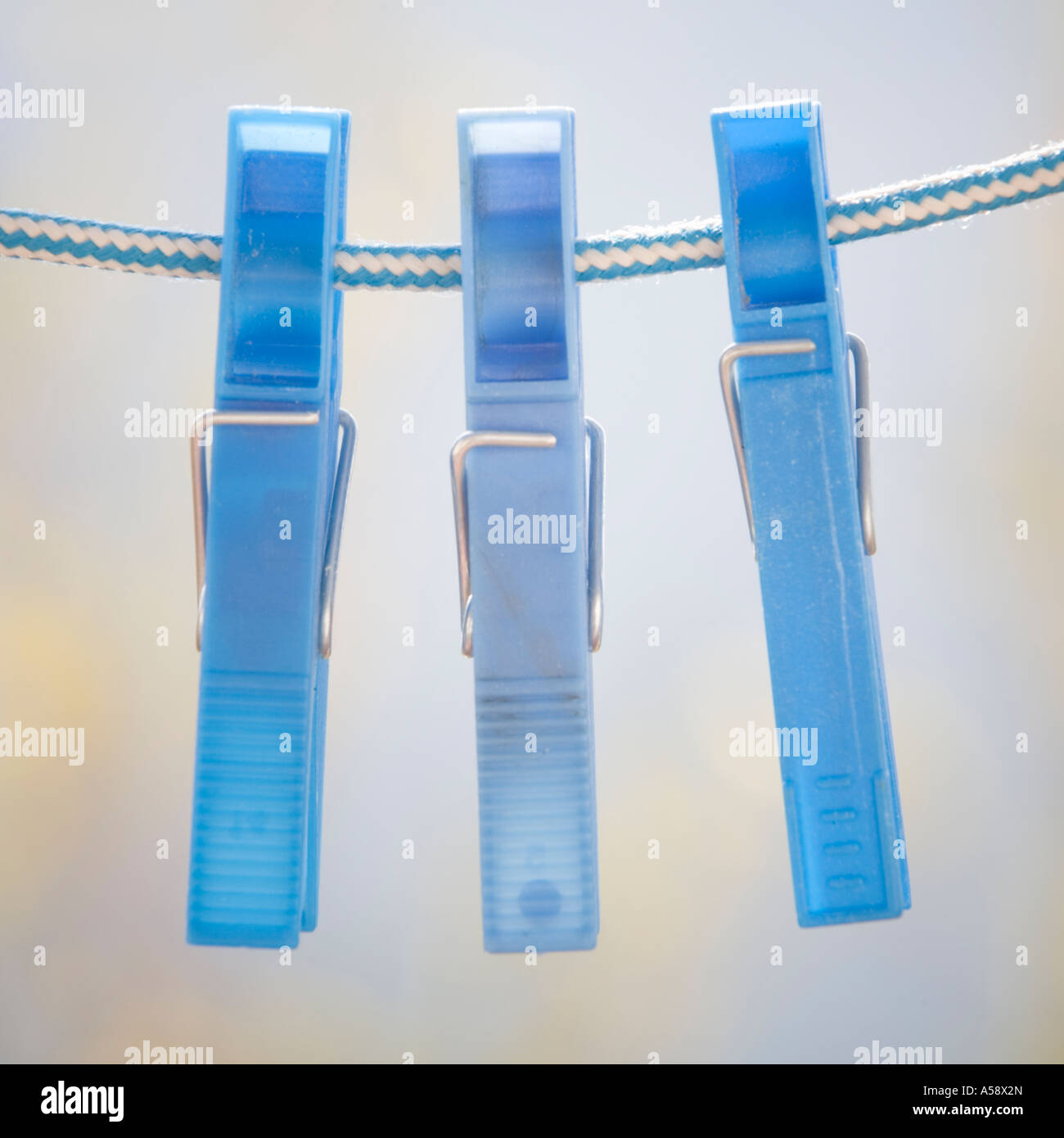 Clothes pegs on a washing line Stock Photo - Alamy