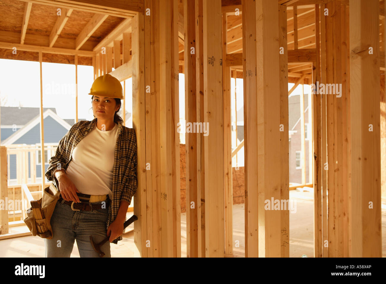Asian female construction worker inside construction site Stock Photo ...