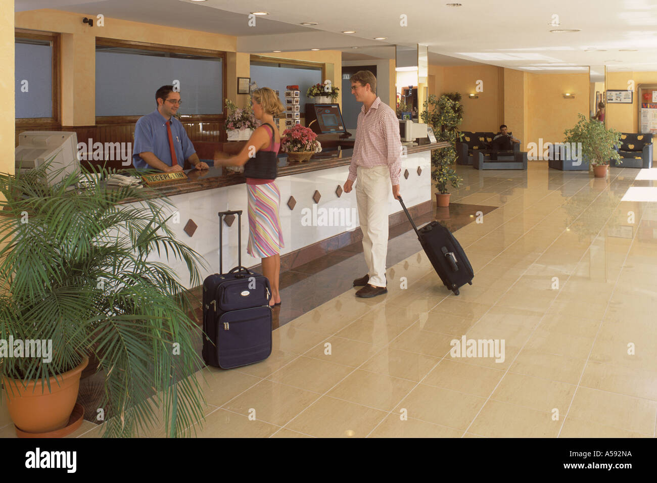 Guests hotel reception hi-res stock photography and images - Alamy