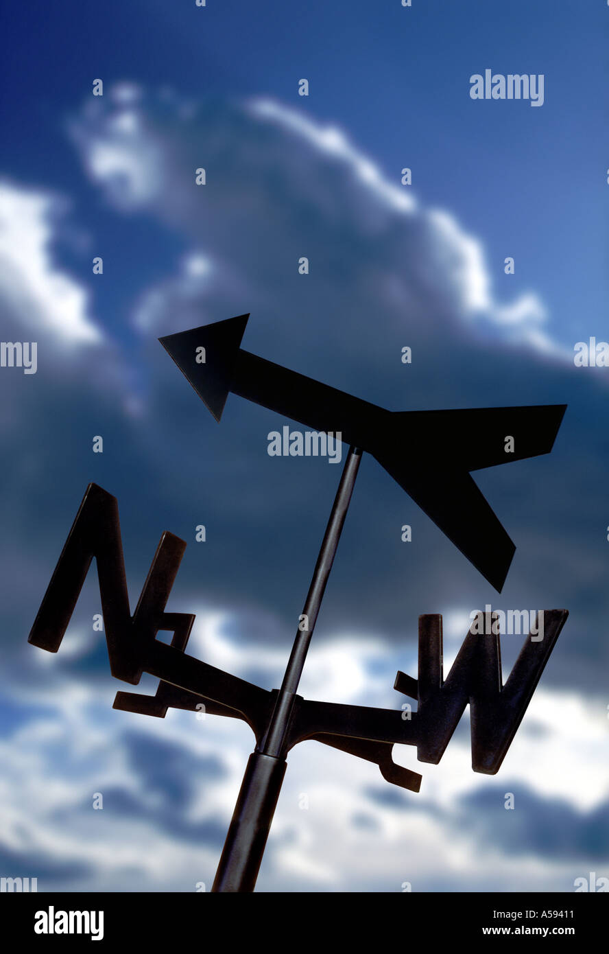 weather vain with directional pointing arrow Stock Photo - Alamy
