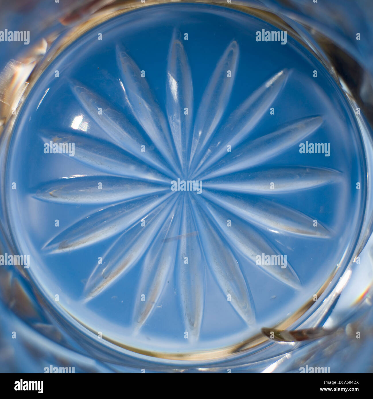 Patterns and textures looking through the bottom of a whiskey glass ...