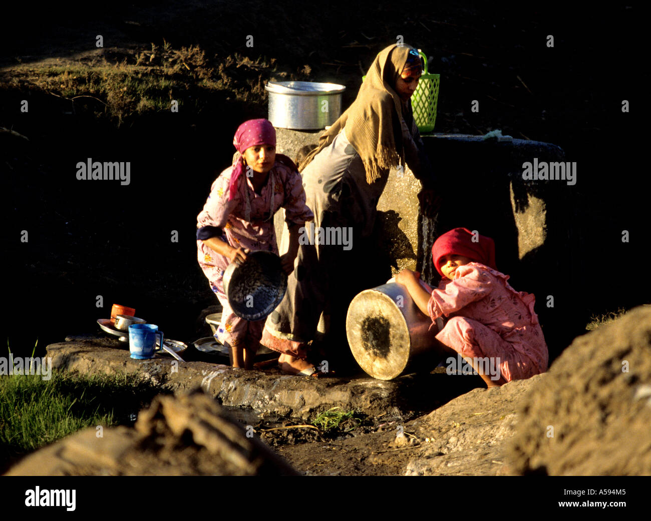Egypt girl girls woman teenager teenagers wash up washing Stock Photo ...