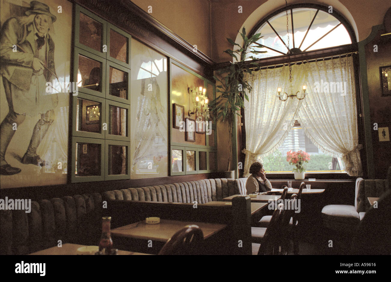 Old woman alone at cafe table hi-res stock photography and images - Alamy