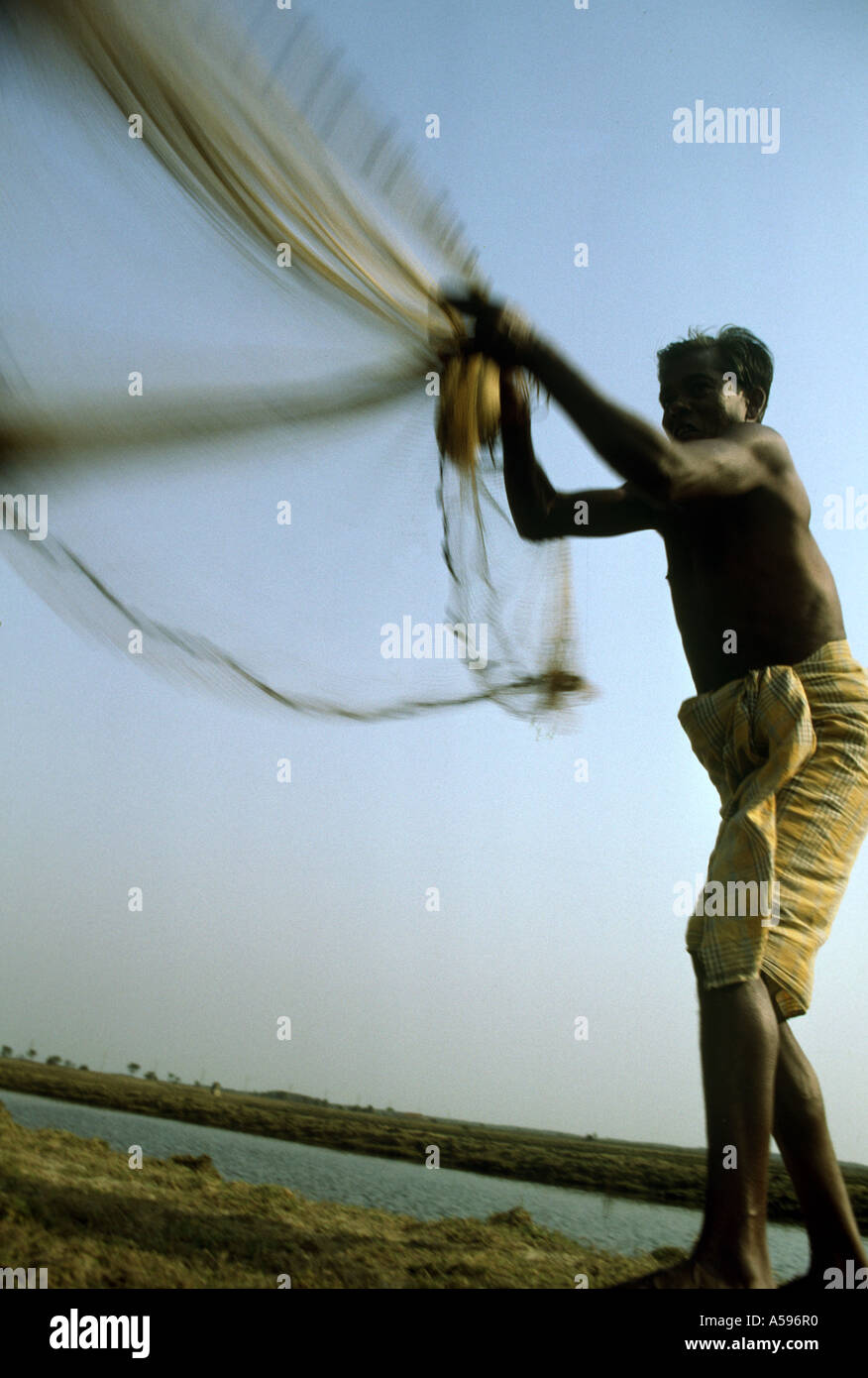 Fisherman throwing fishing net west hi-res stock photography and images ...
