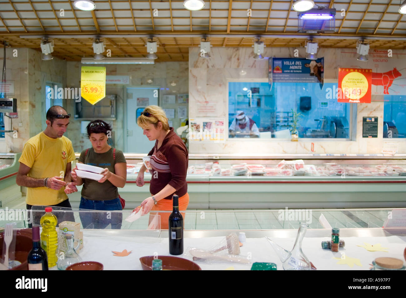 People checking prices at supermarket Stock Photo - Alamy