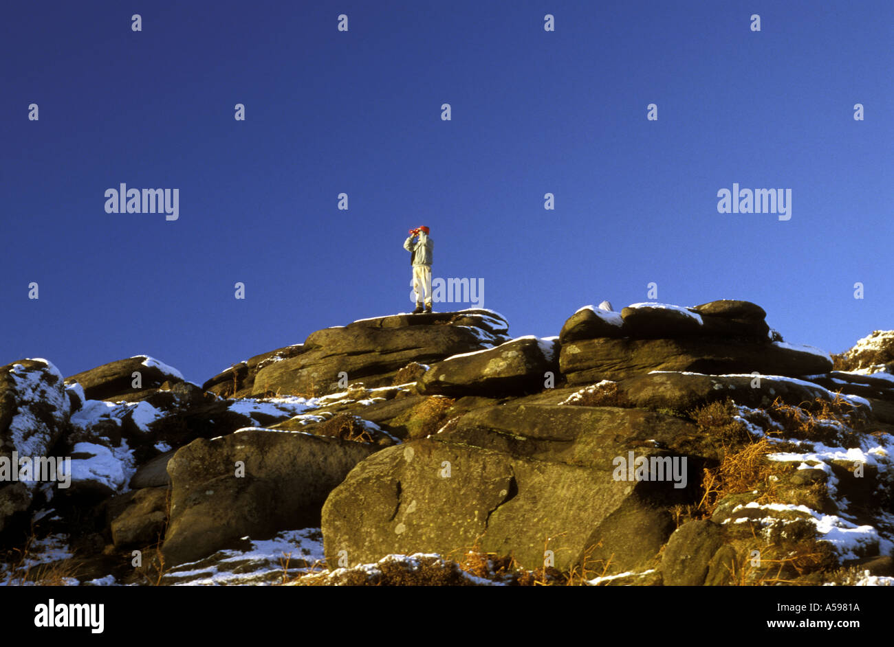 LONE WALKER VIEWING THE PEAK DISTRICT NATIONAL PARK FROM BURBAGE EDGE ...