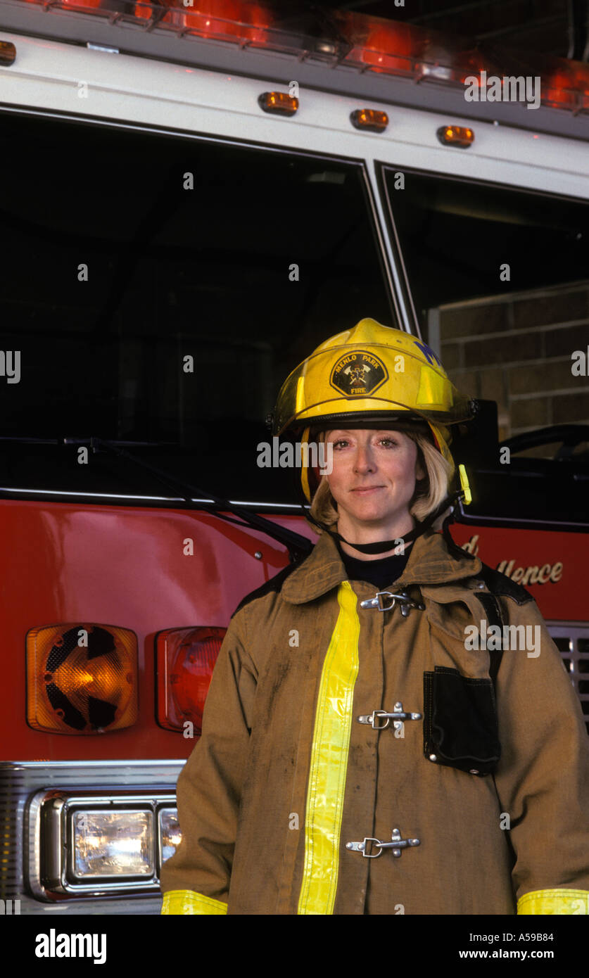 female firefighter posing in front of fire truck in Burlingame ...