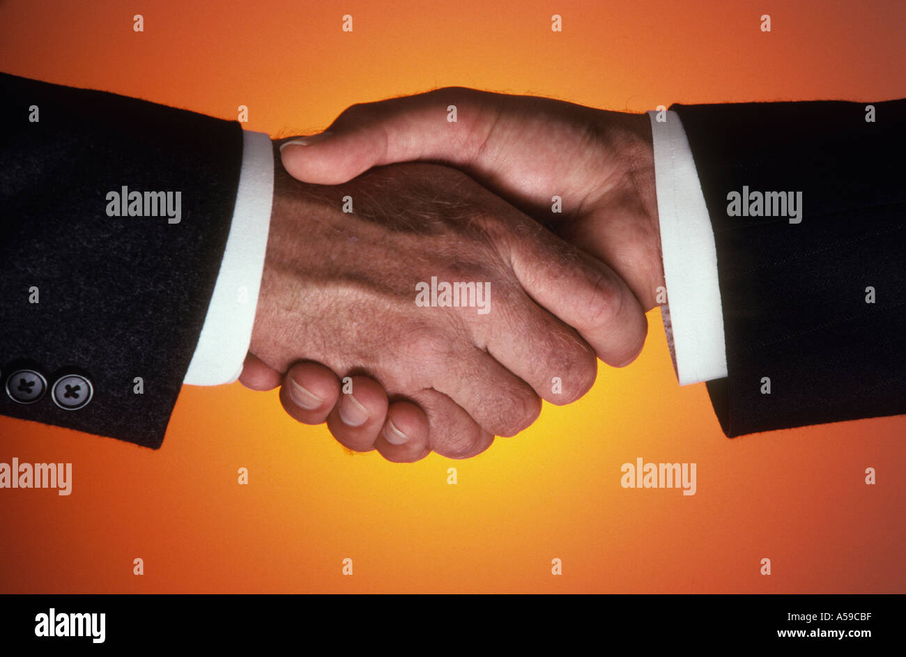 hand shake between two male business executives Stock Photo - Alamy