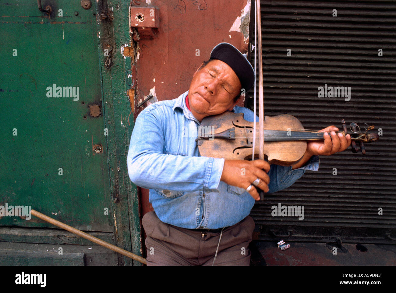 Blind Musician playing his violin at the street Stock Photo - Alamy
