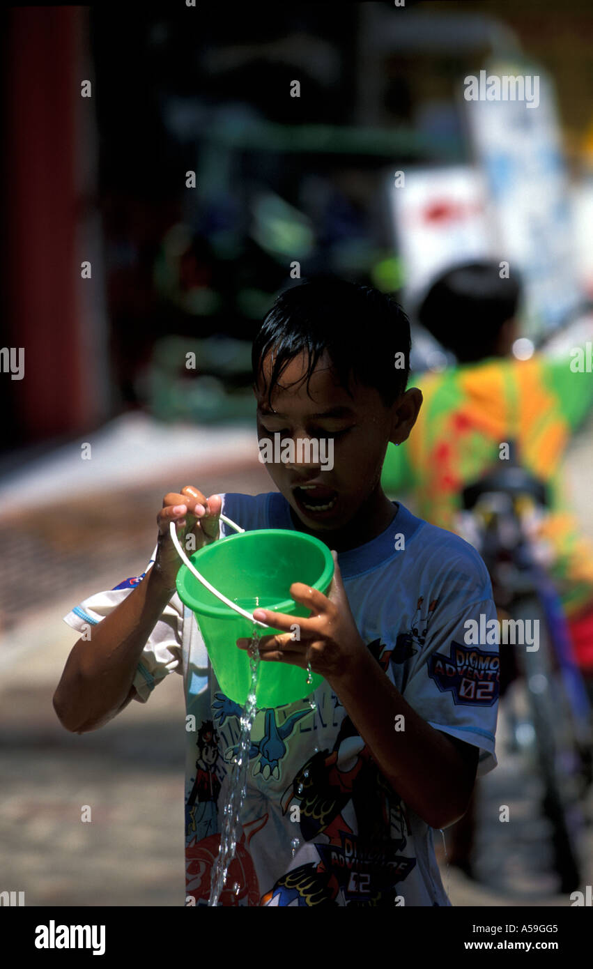 Young boy prepared for water fight Stock Photo - Alamy