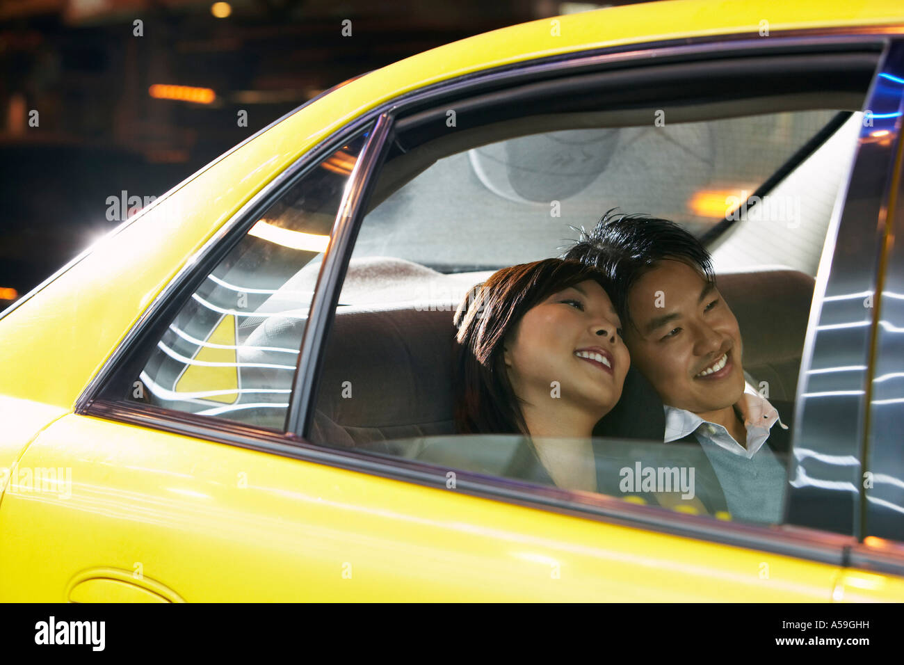 Two people in yellow cab hi-res stock photography and images - Alamy