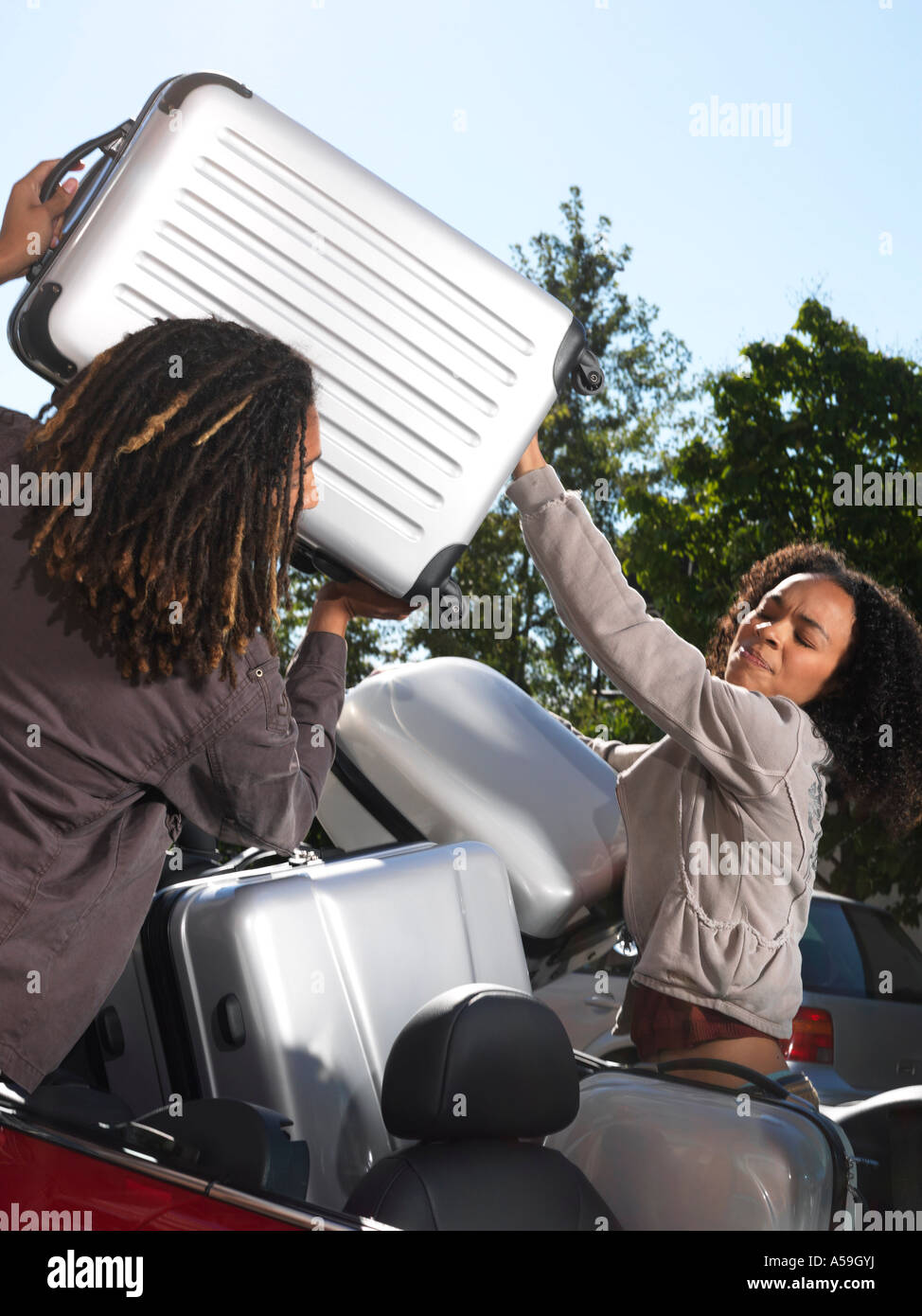 Old man carrying heavy luggage hi-res stock photography and images - Alamy