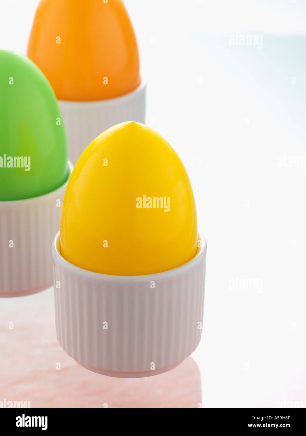 Easter Eggs in White Eggcups Stock Photo - Alamy