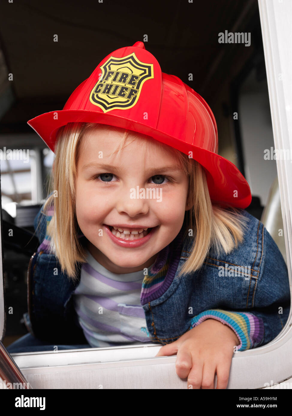 Child driving fire truck hi-res stock photography and images - Alamy