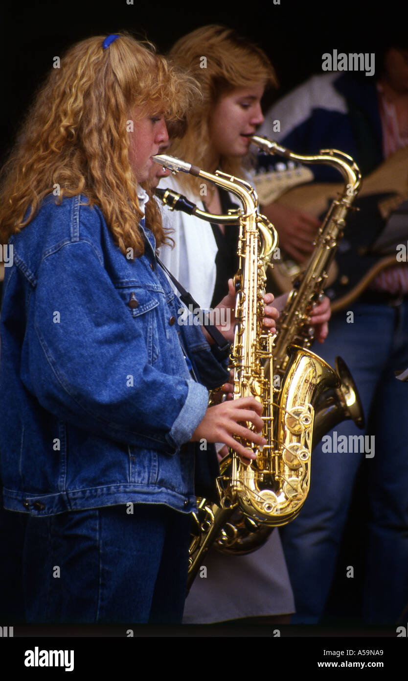 Girls playing wind musical instruments in church youth orchestra Stock ...