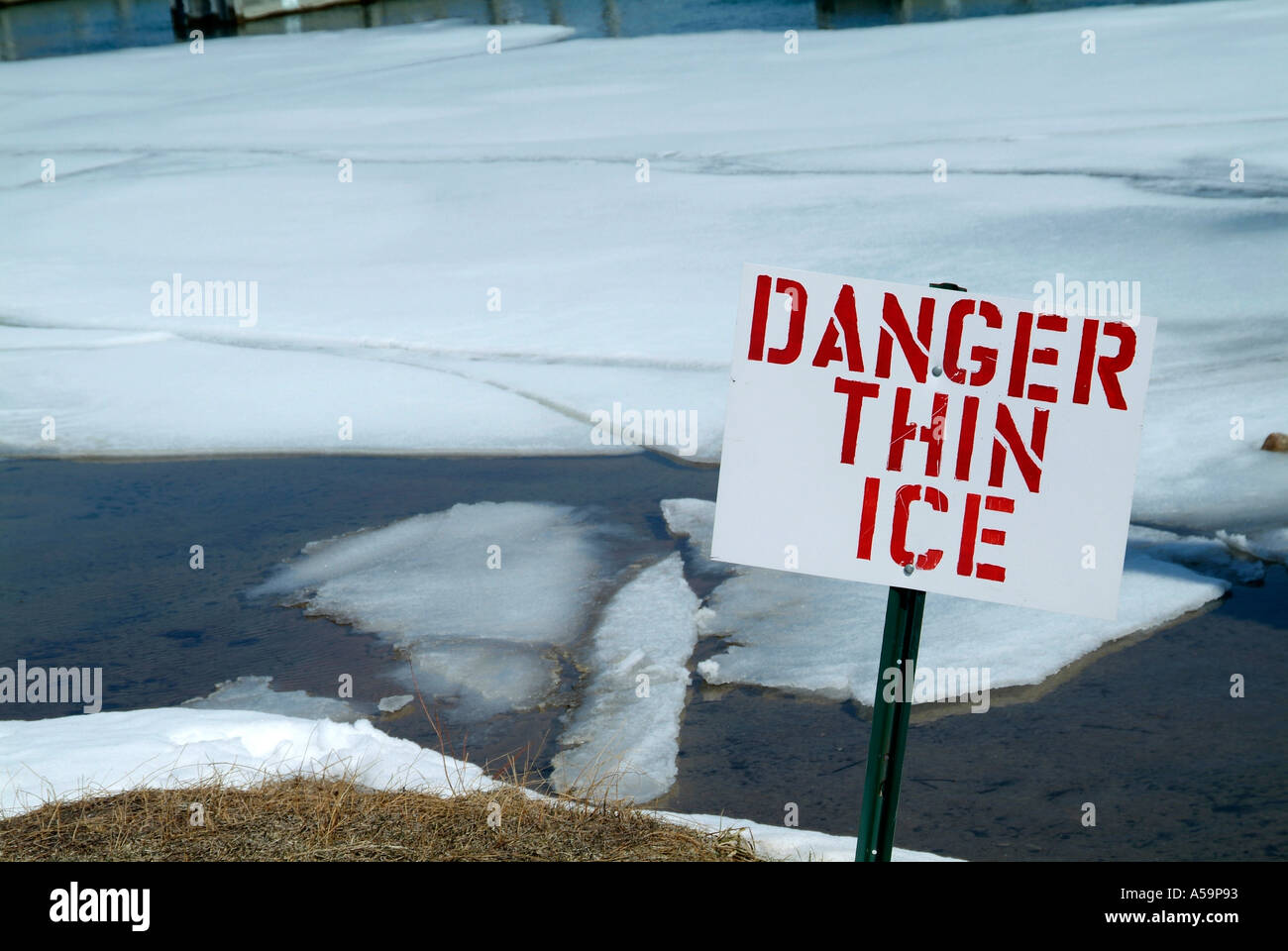 Sign indicating danger thin ice Stock Photo - Alamy